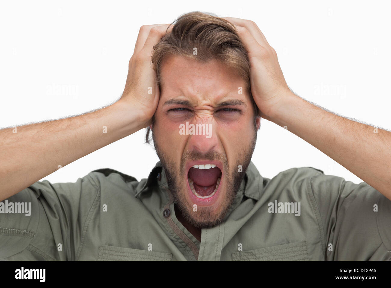 Furious man with hands on head Stock Photo - Alamy