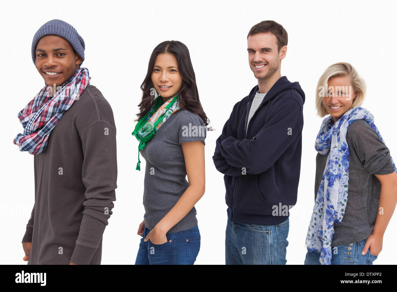 Stylish young people in a row smiling Stock Photo - Alamy