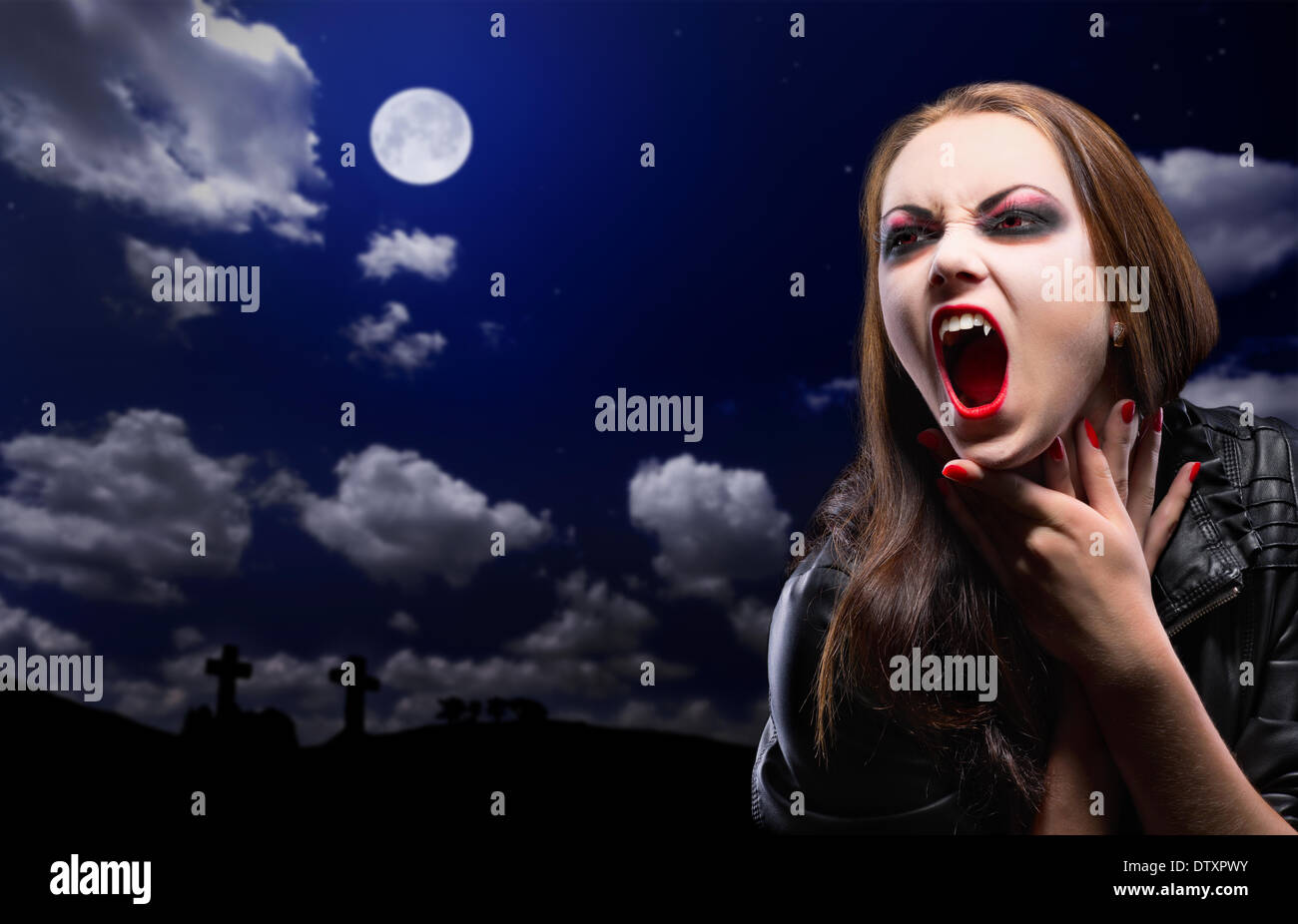 Vampire girl on night sky background Stock Photo - Alamy
