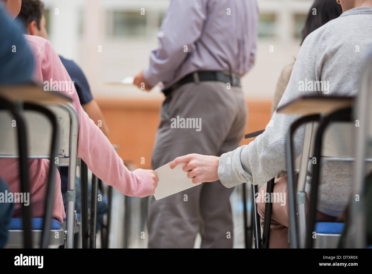 Students passing notes Stock Photo - Alamy Students passing notes Stock Photo - Alamy