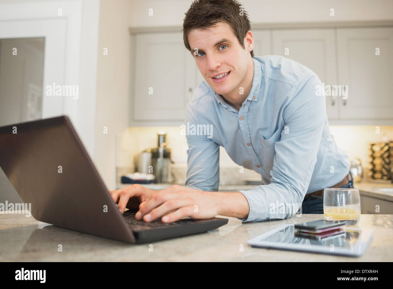 Man typing at the laptop Stock Photo - Alamy