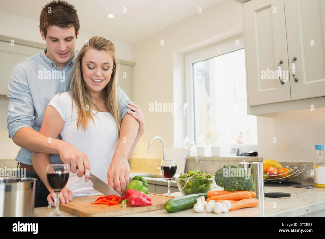 Blonde woman cooking husband hi-res stock photography and images - Alamy