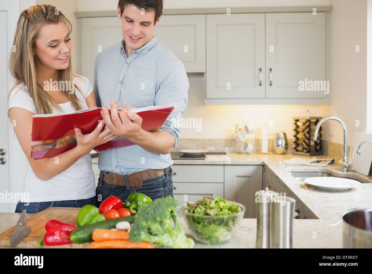 Man reading cookbook hi-res stock photography and images - Alamy