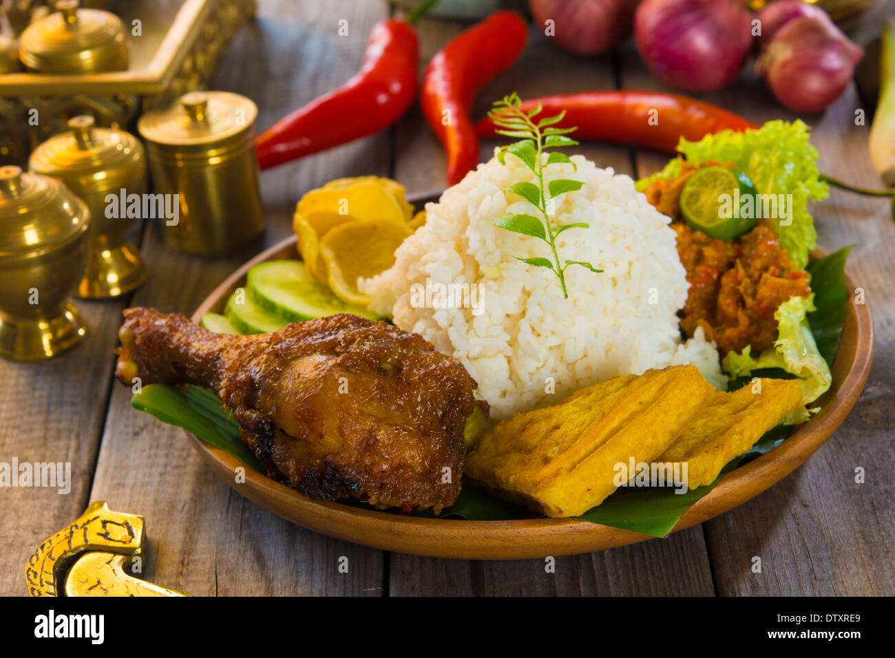 indonesian fried chicken rice on traditional background Stock Photo - Alamy