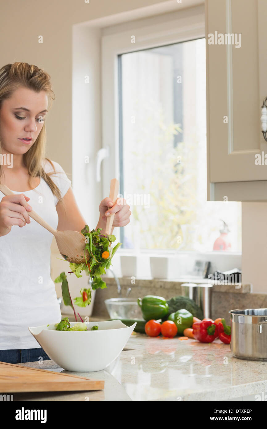 Young woman making salad 20s adult hi-res stock photography and images ...