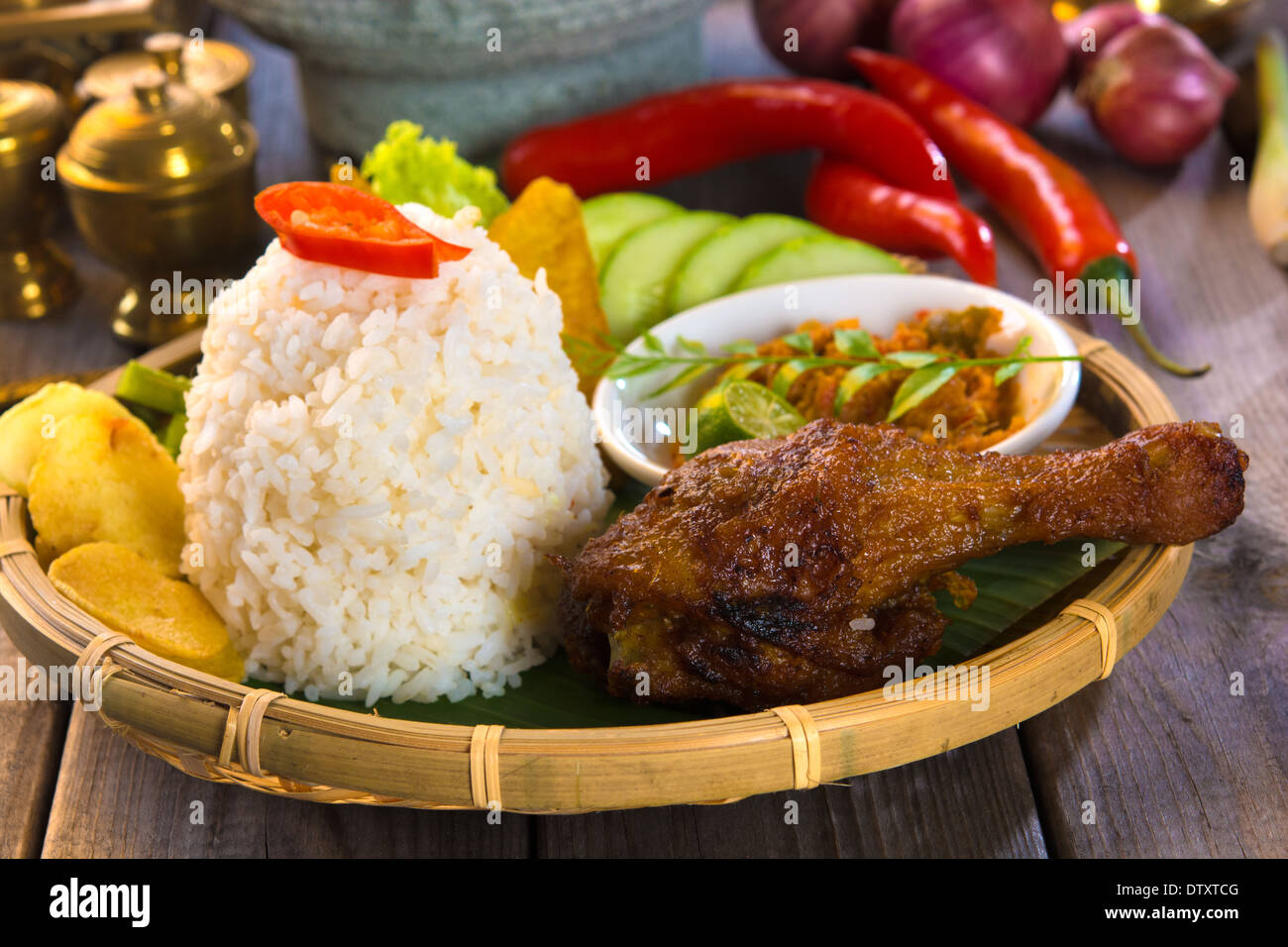 indonesian fried chicken rice on traditional background Stock Photo - Alamy