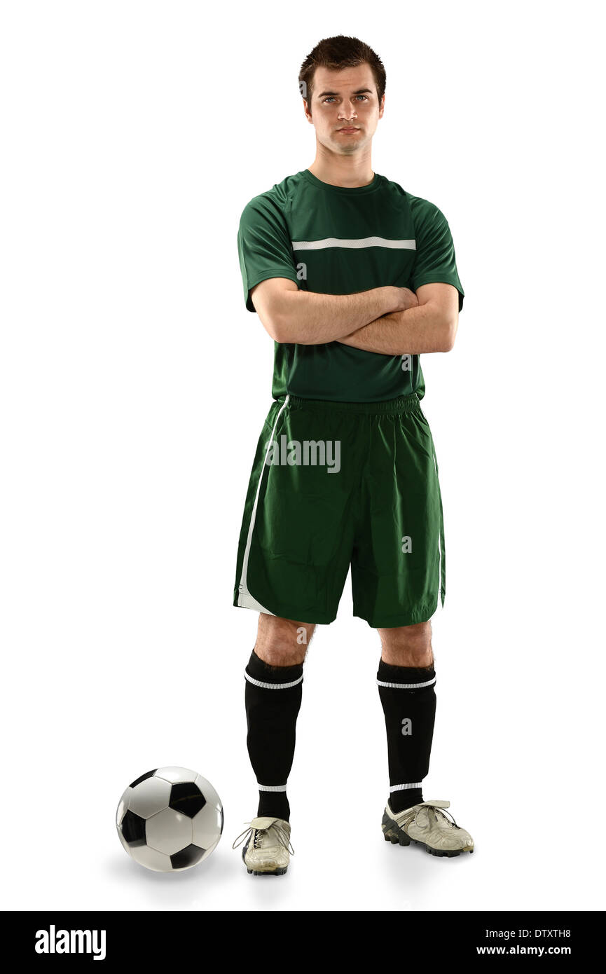 Young soccer player standing with arms crossed isolated over white ...