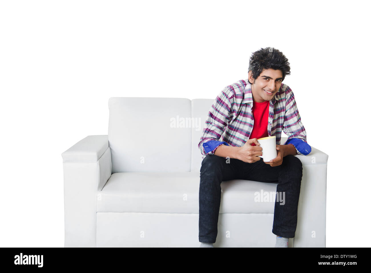 1 indian boy sitting and drinking tea Stock Photo - Alamy
