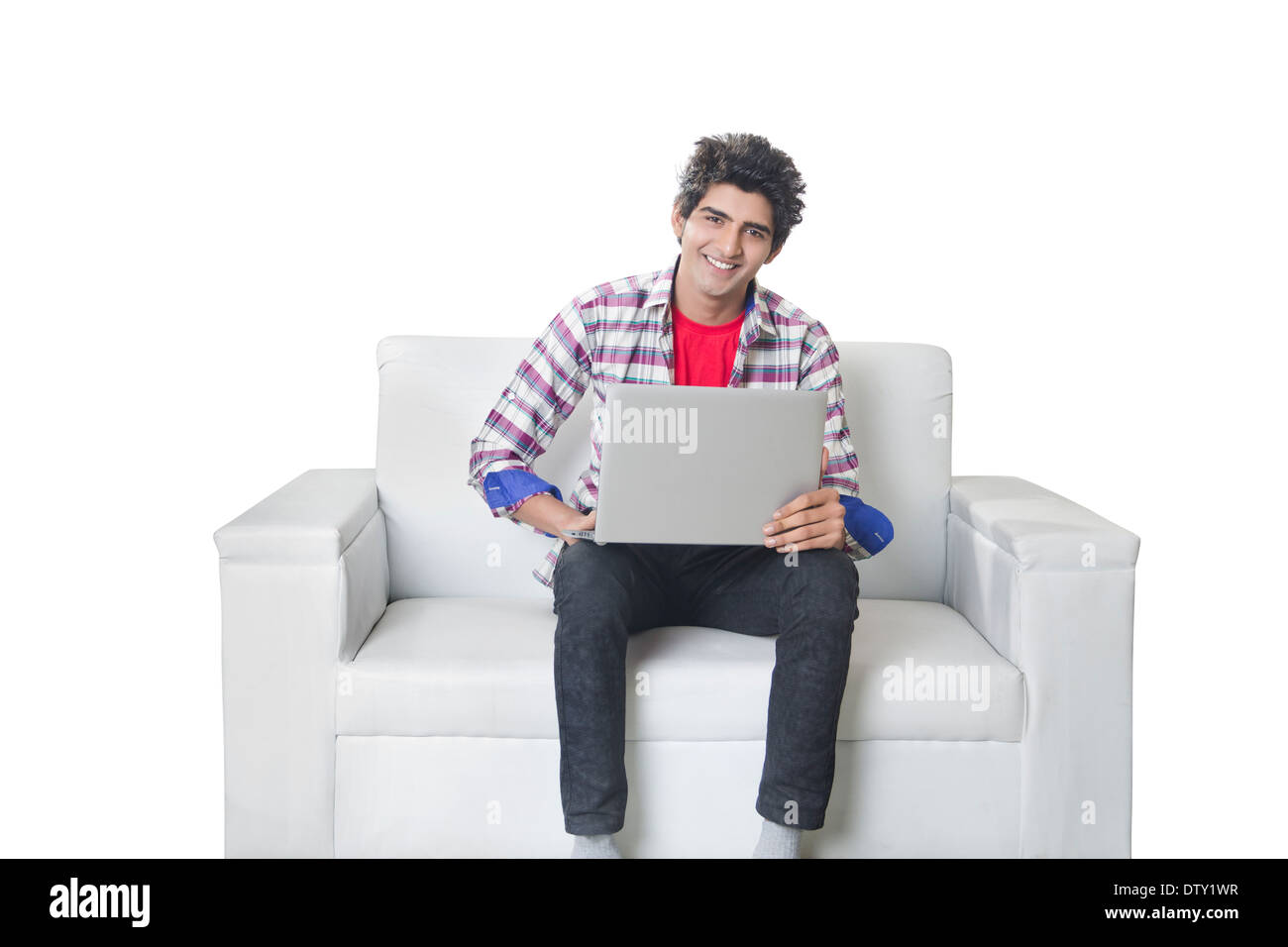 1 indian boy sitting with laptop and working Stock Photo - Alamy