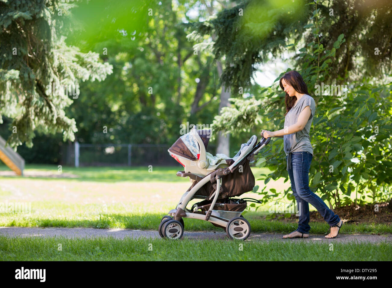 Mom pushing stroller hi-res stock photography and images - Alamy