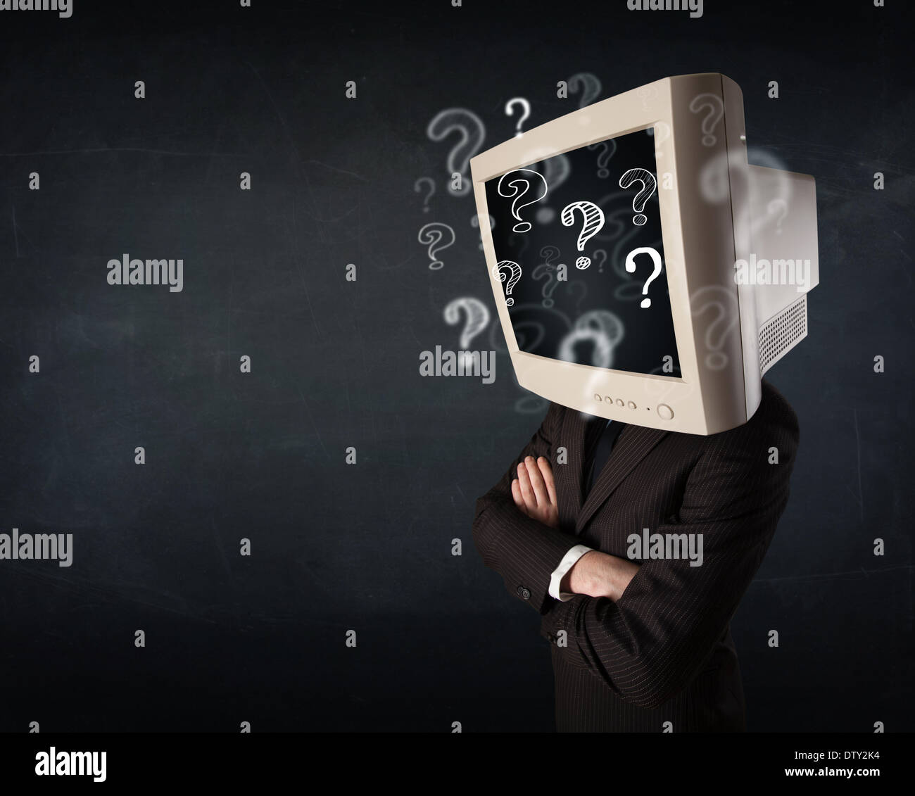 Businessman with a computer monitor head and question marks Stock Photo ...