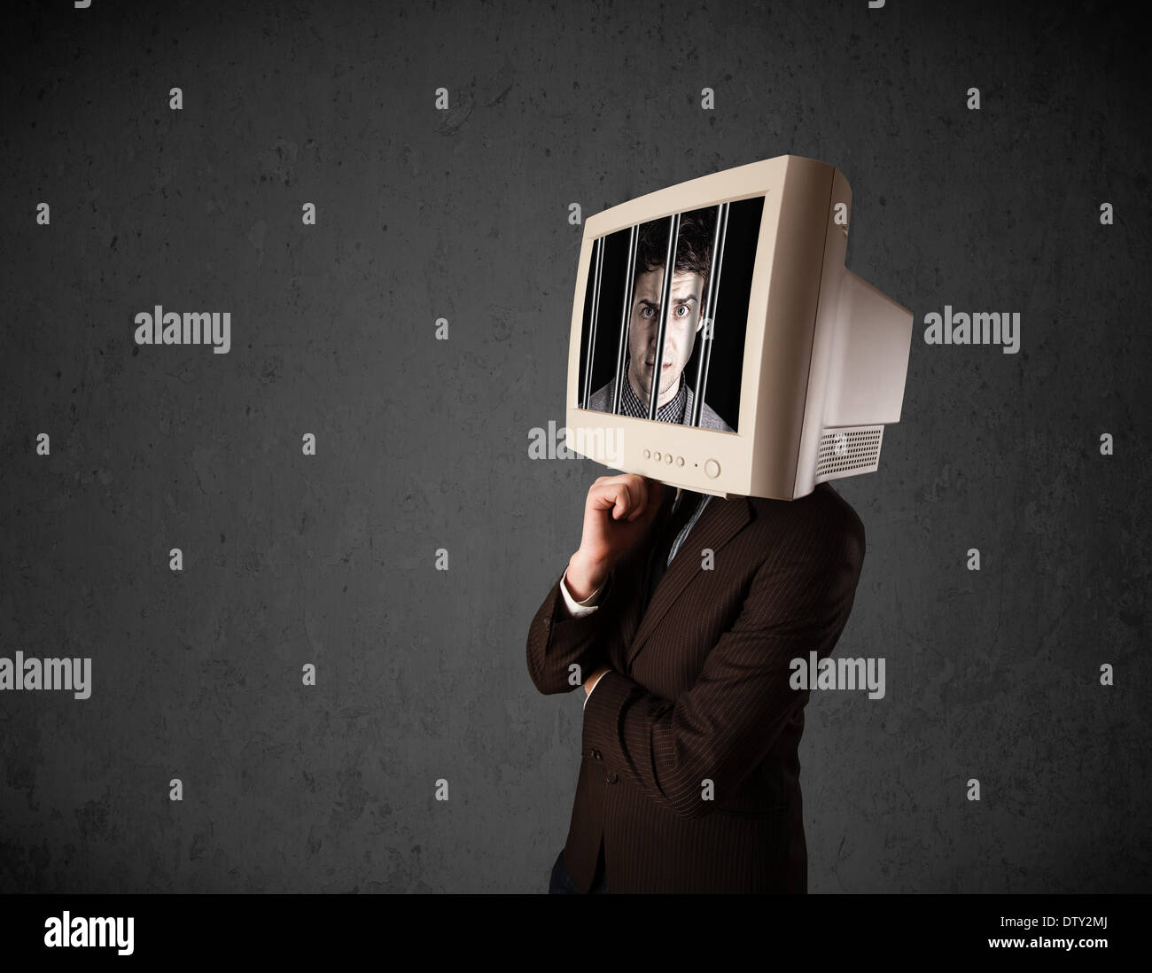 Business man with monitor on his head traped into a digital system ...