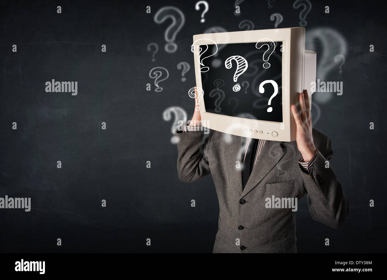 Businessman with a computer monitor head and question marks Stock Photo ...