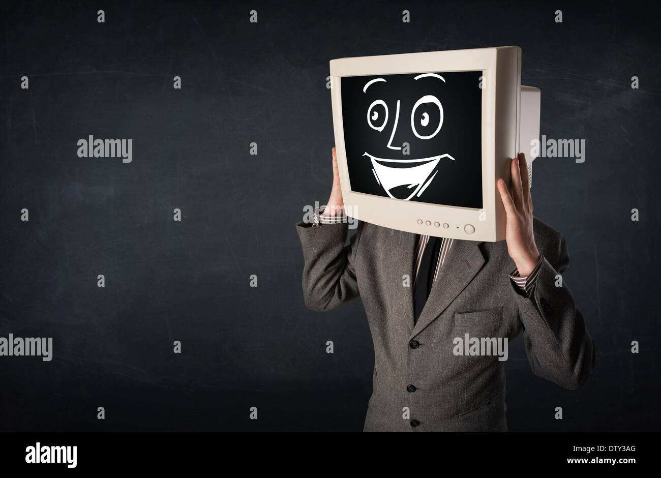 Happy businessman with a PC monitor head and a smiley face Stock Photo ...