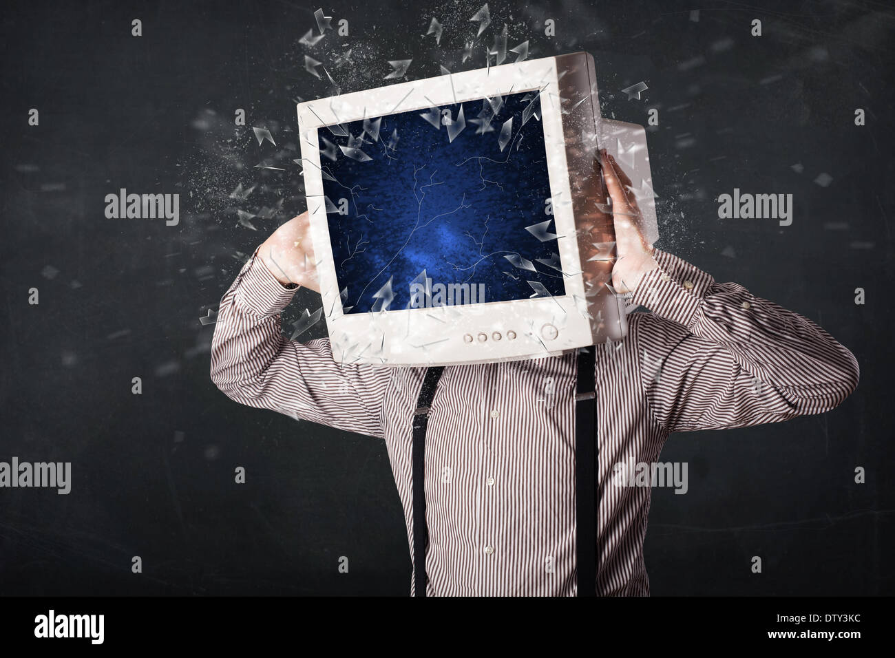 Computer monitor screen exploding on a young persons head Stock Photo - Alamy