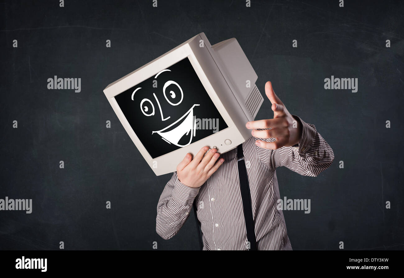 Happy businessman with a PC monitor head and a smiley face Stock Photo ...