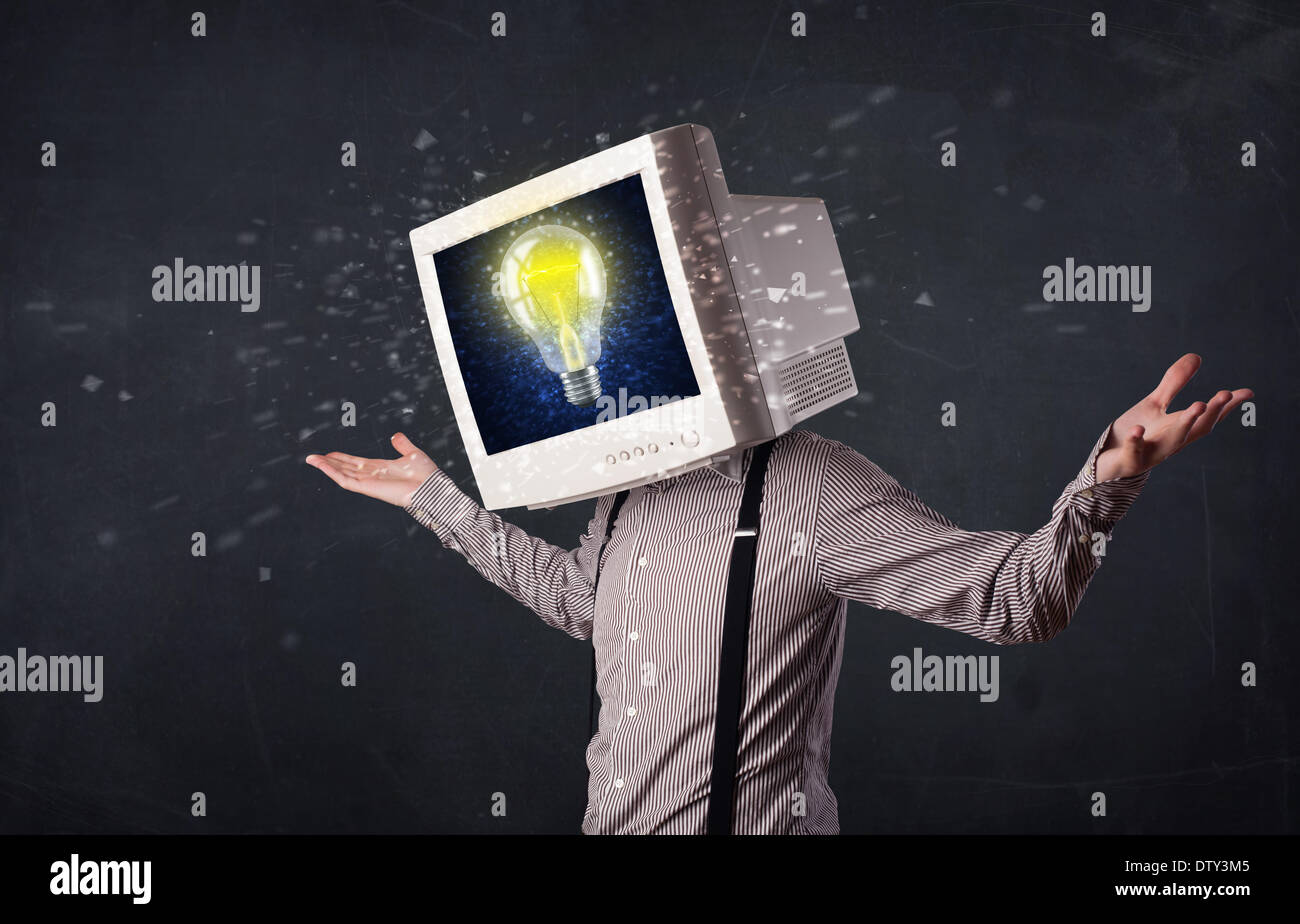 Business man with a pc monitor head and idea light bulb in the display ...
