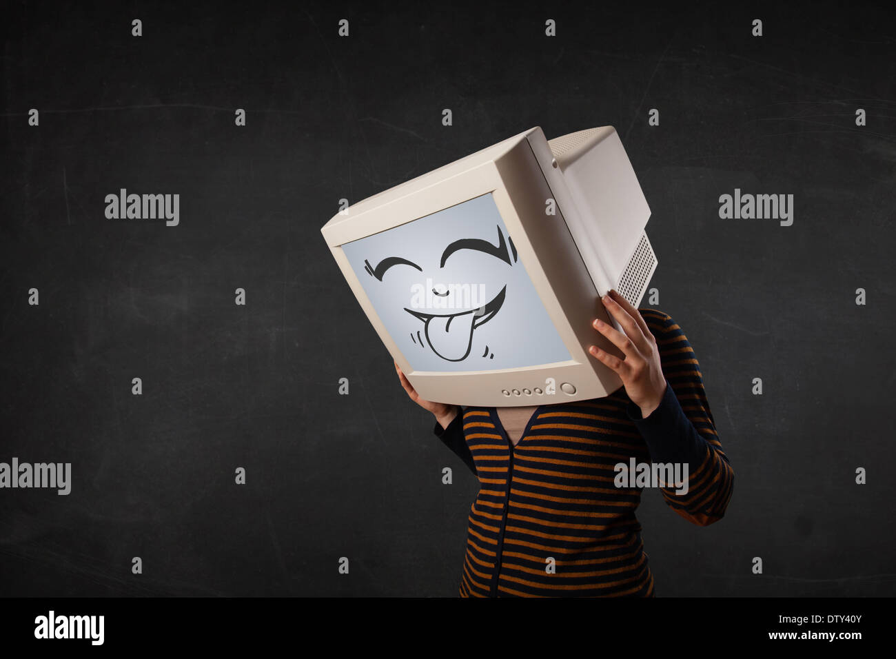 Young girl wearing a monitor with a funny face Stock Photo - Alamy