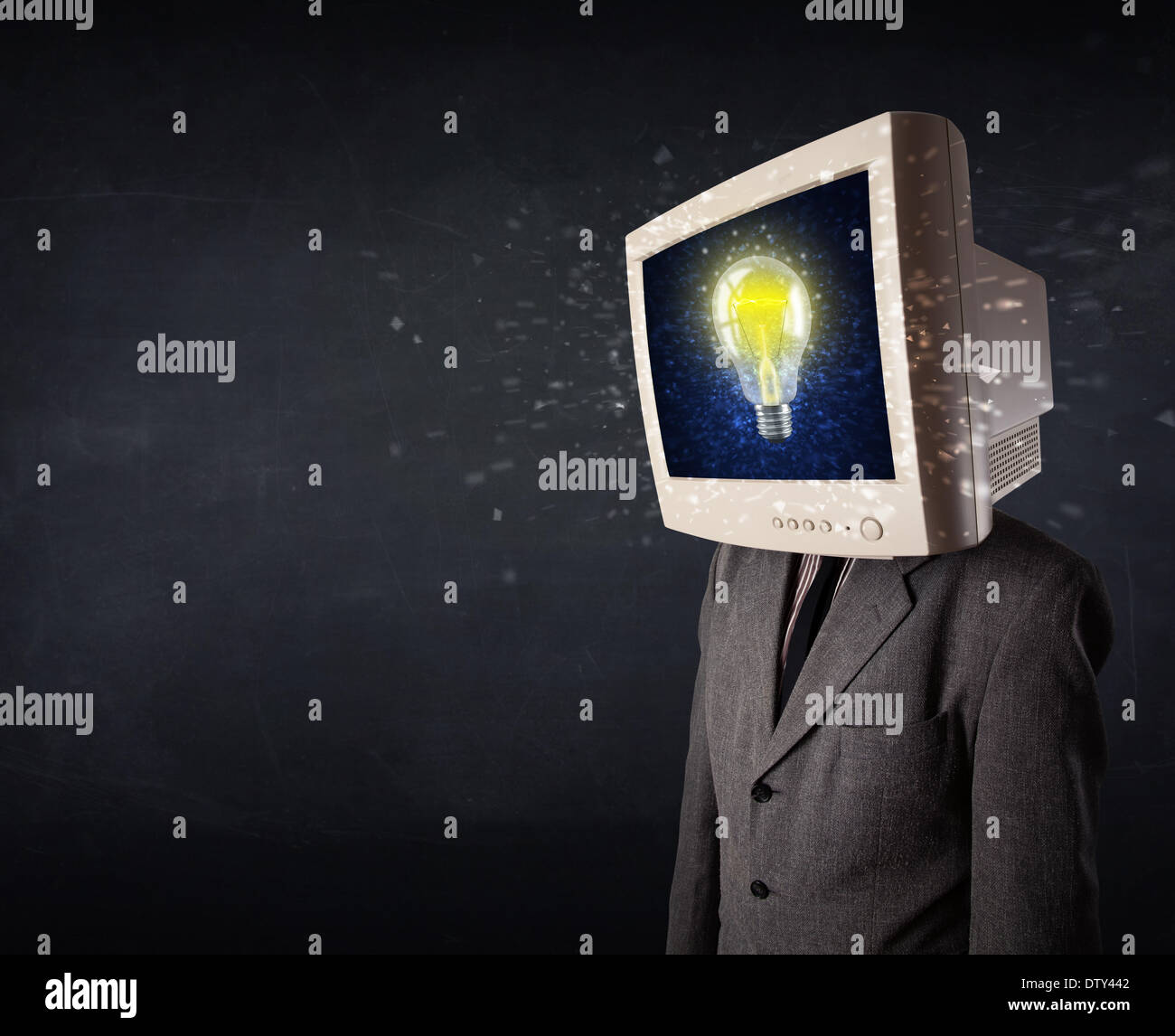 Business man with a pc monitor head and idea light bulb in the display ...
