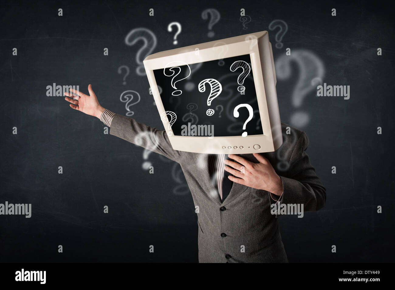 Businessman with a computer monitor head and question marks Stock Photo ...