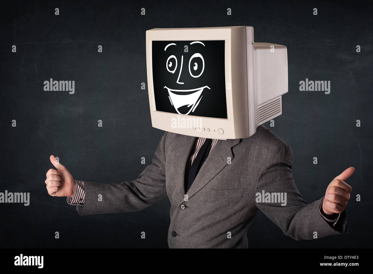 Happy businessman with a PC monitor head and a smiley face Stock Photo ...
