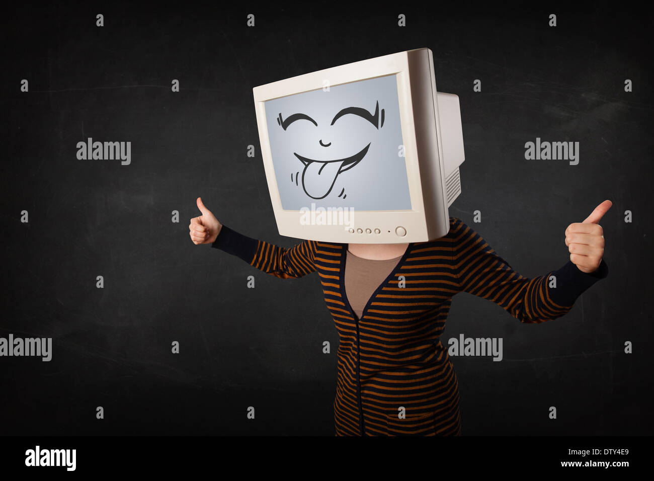 Young girl wearing a monitor with a funny face Stock Photo - Alamy