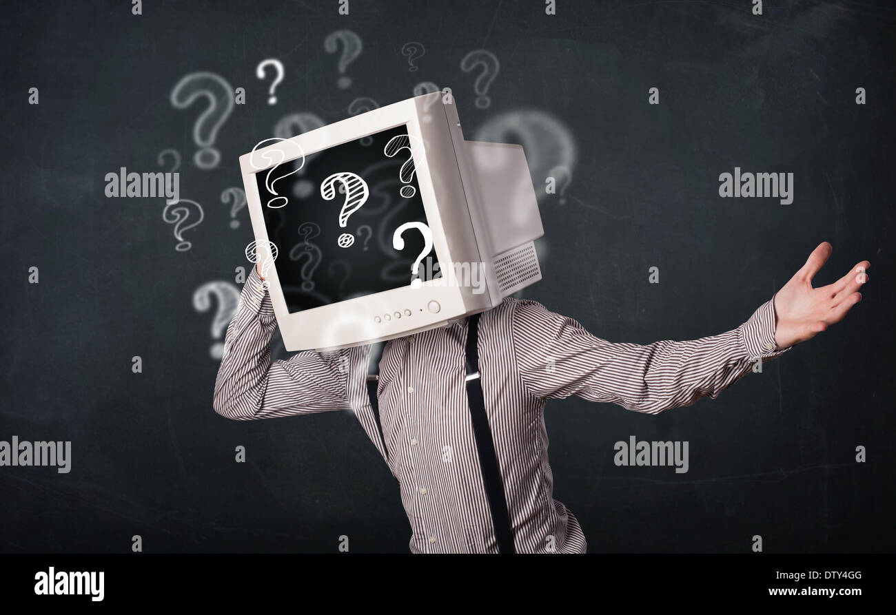Businessman with a computer monitor head and question marks Stock Photo ...