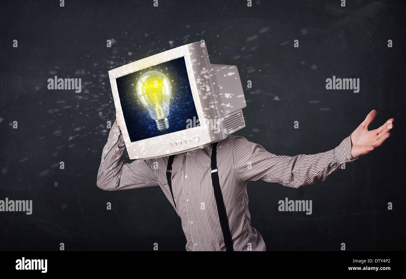 Business man with a pc monitor head and idea light bulb in the display ...