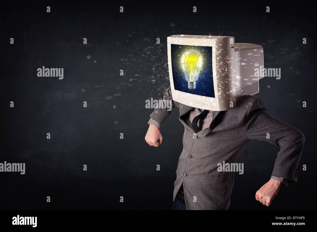 Business man with a pc monitor head and idea light bulb in the display ...