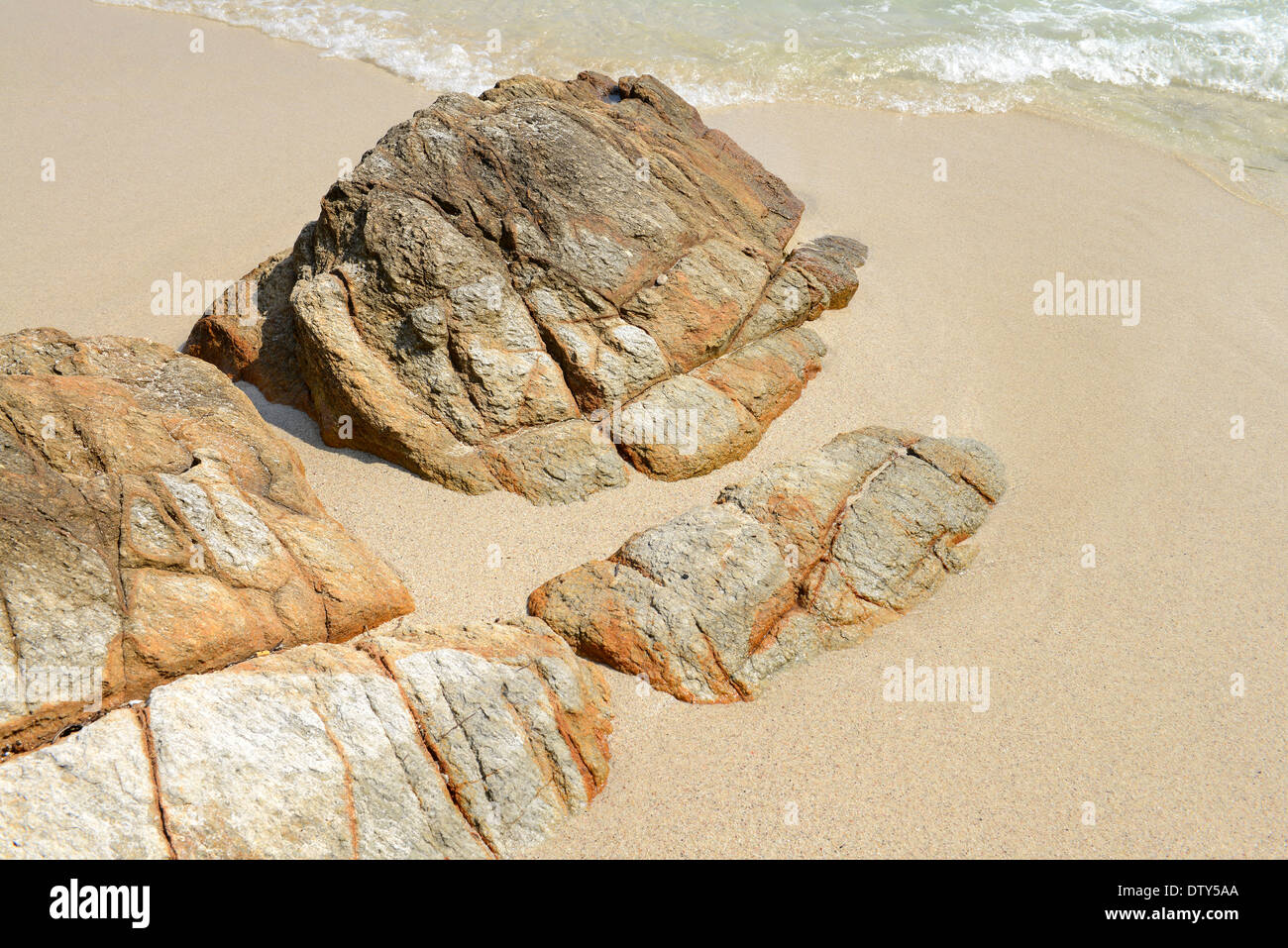 Tropical Beach with Rocks Sand and Waves Stock Photo - Alamy