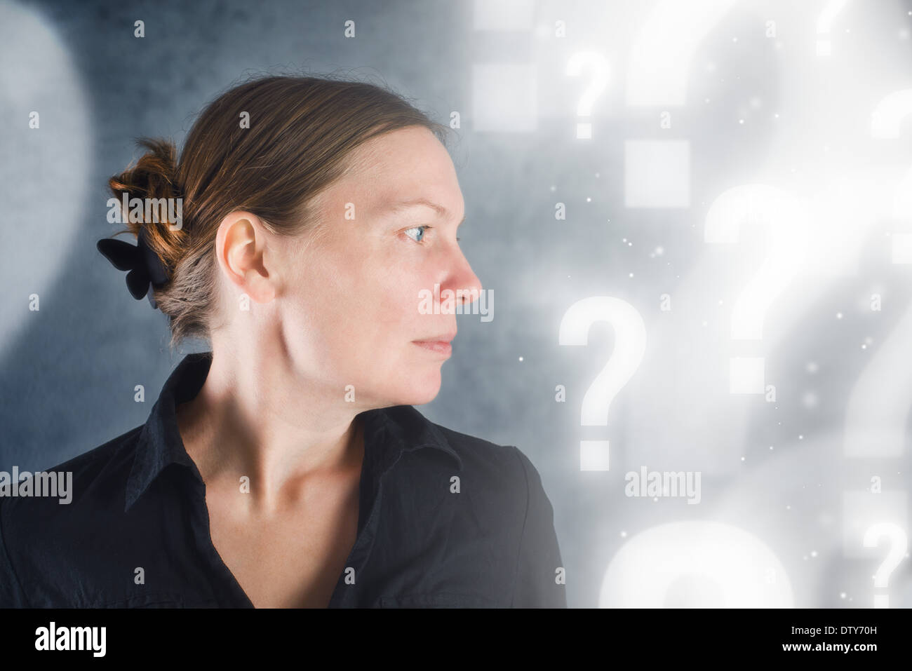 Woman thinking question marks hi-res stock photography and images - Alamy