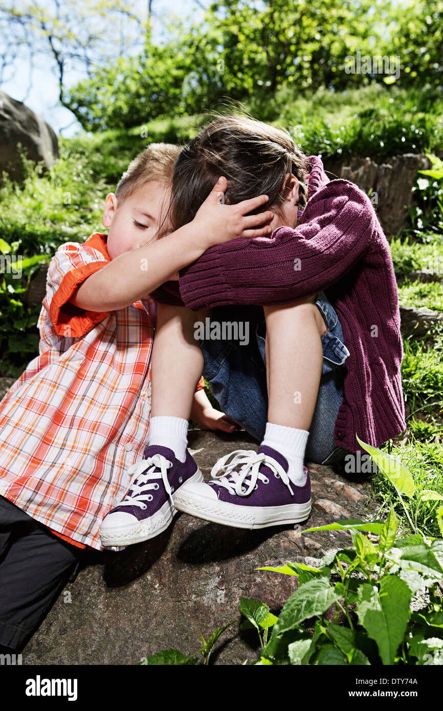 Two Sad Boys Hugging