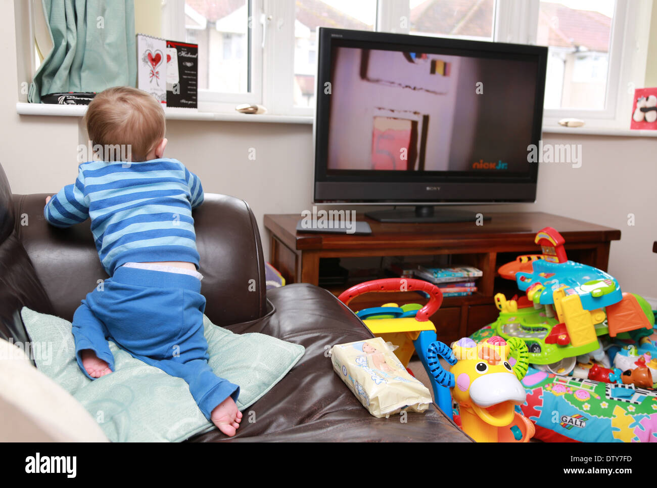 Baby watching videos hi-res stock photography and images - Alamy