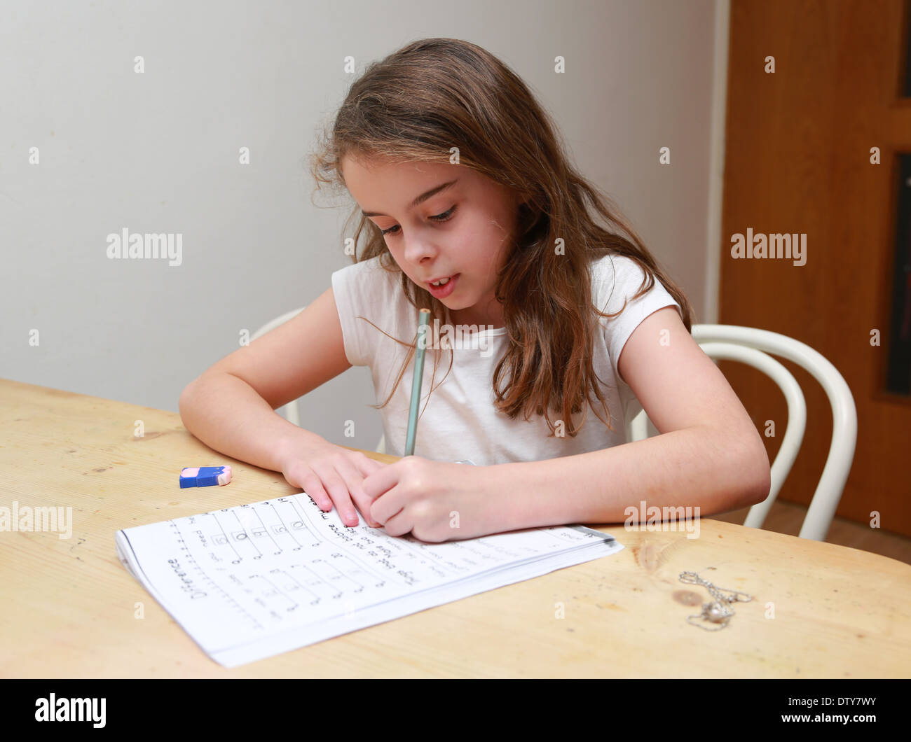 Child doing homework at home Stock Photo - Alamy