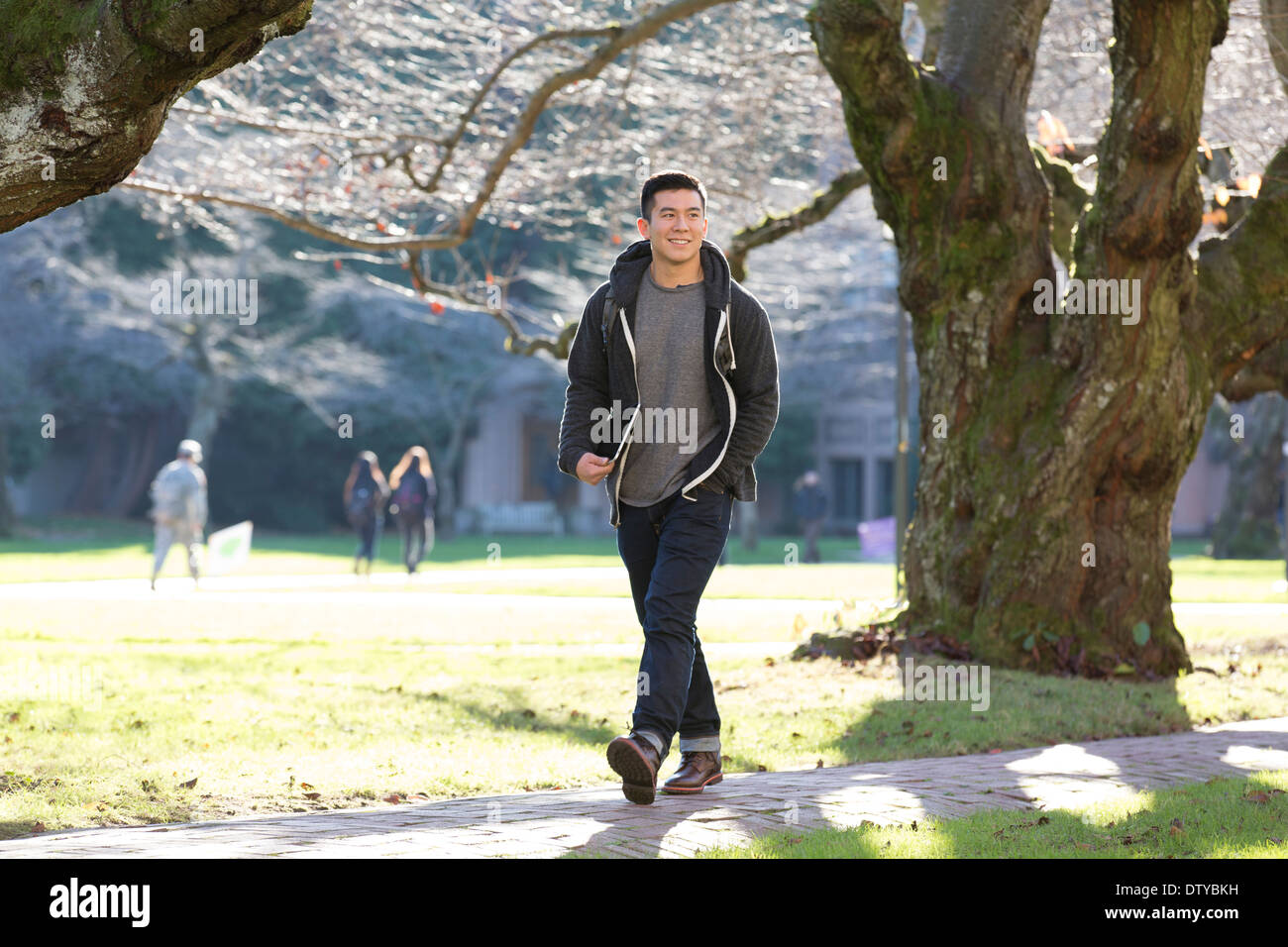 College Student Walking On Campus High Resolution Stock Photography and ...