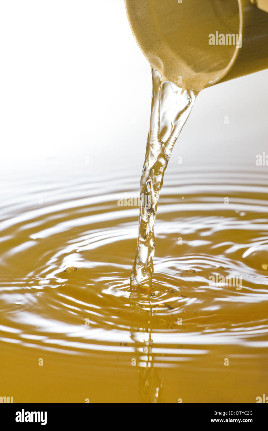Pouring rice wine Stock Photo - Alamy