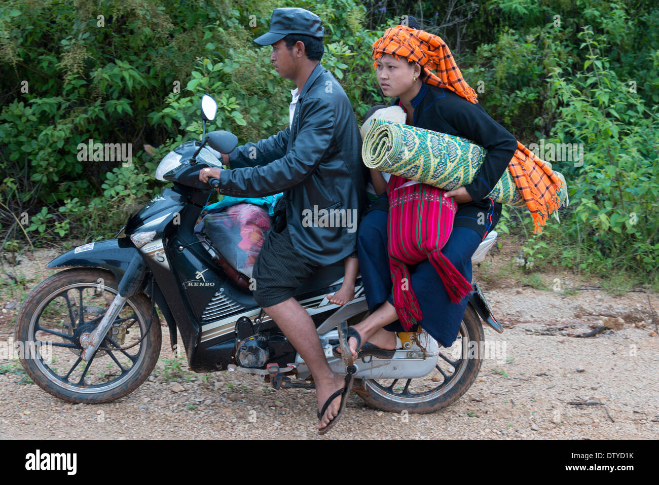 Couple on a motorbike. Taung Klamuk hilltribe village. Paoh ethnic ...