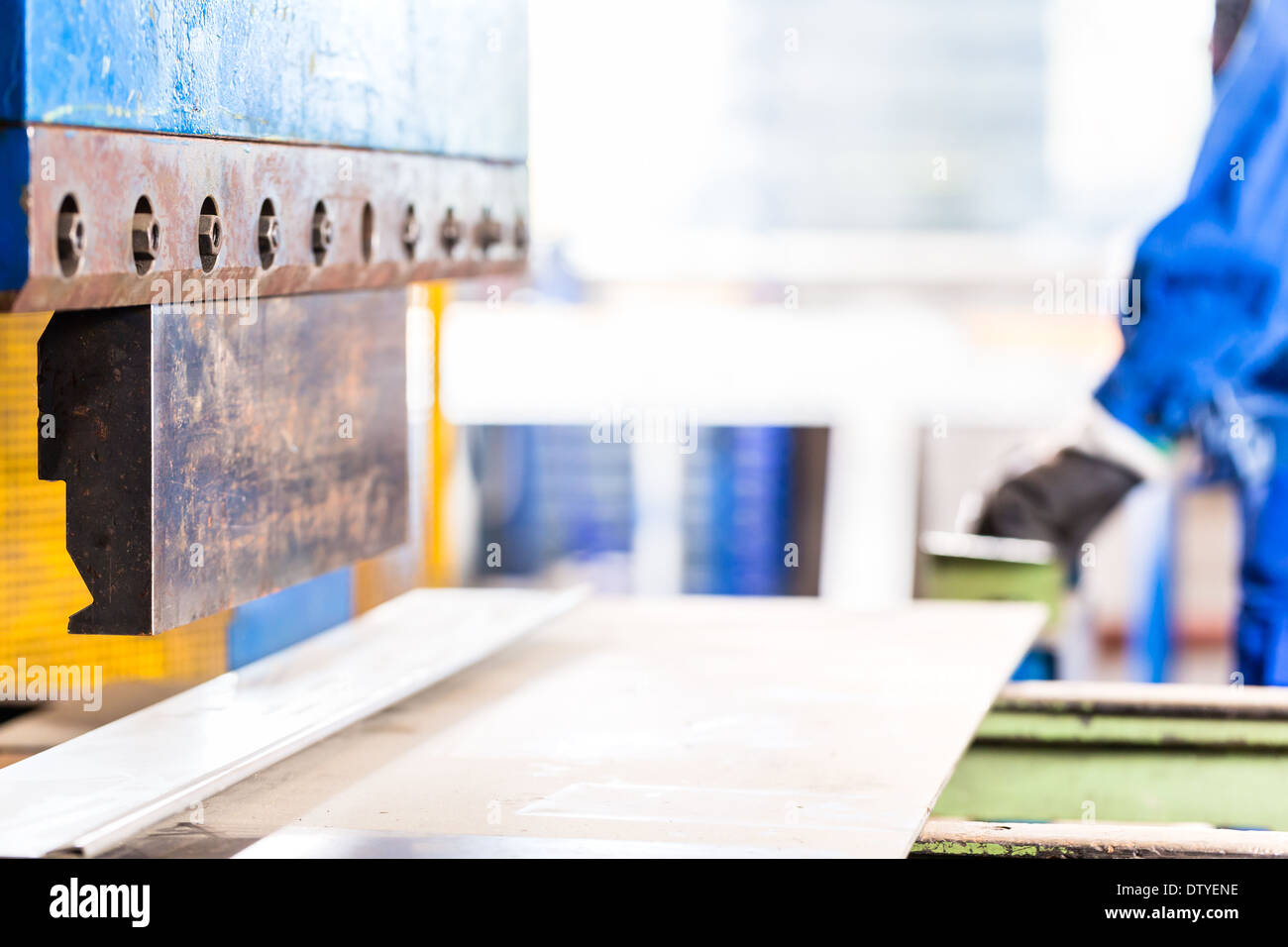 Craftsman forming metal with skip in workshop Stock Photo - Alamy