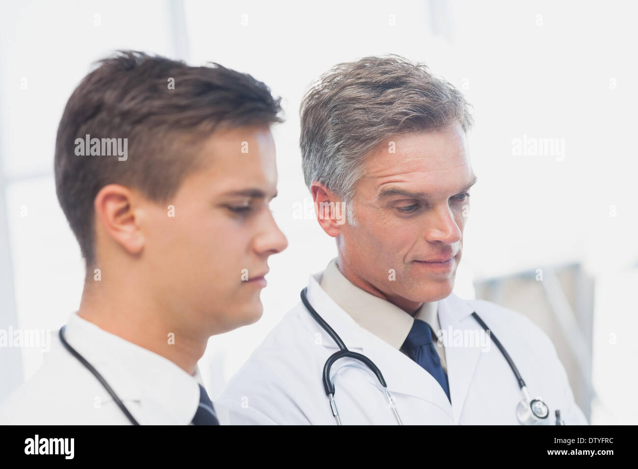 Handsome smiling doctors standing hi-res stock photography and images ...
