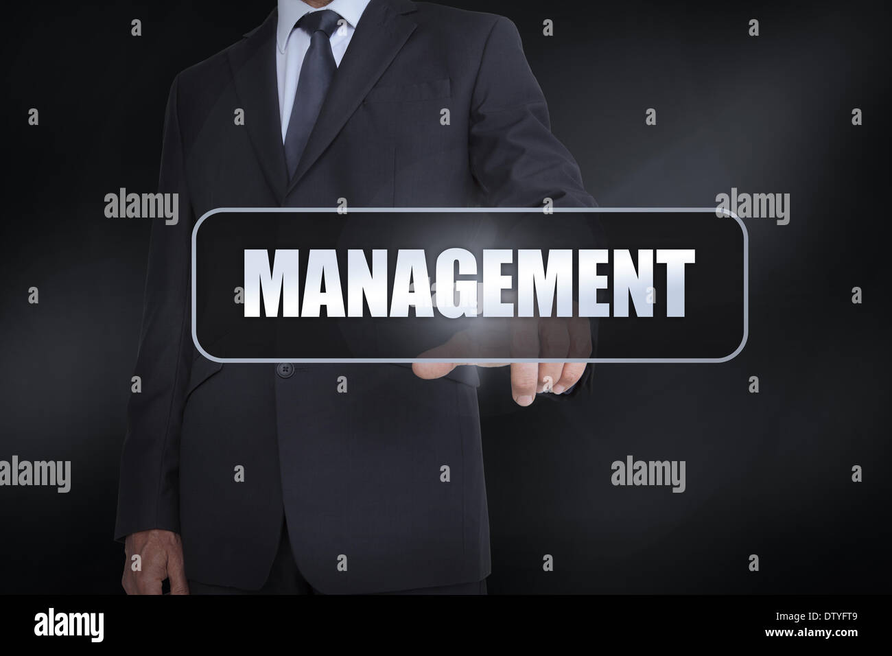 Businessman pressing the word management Stock Photo - Alamy