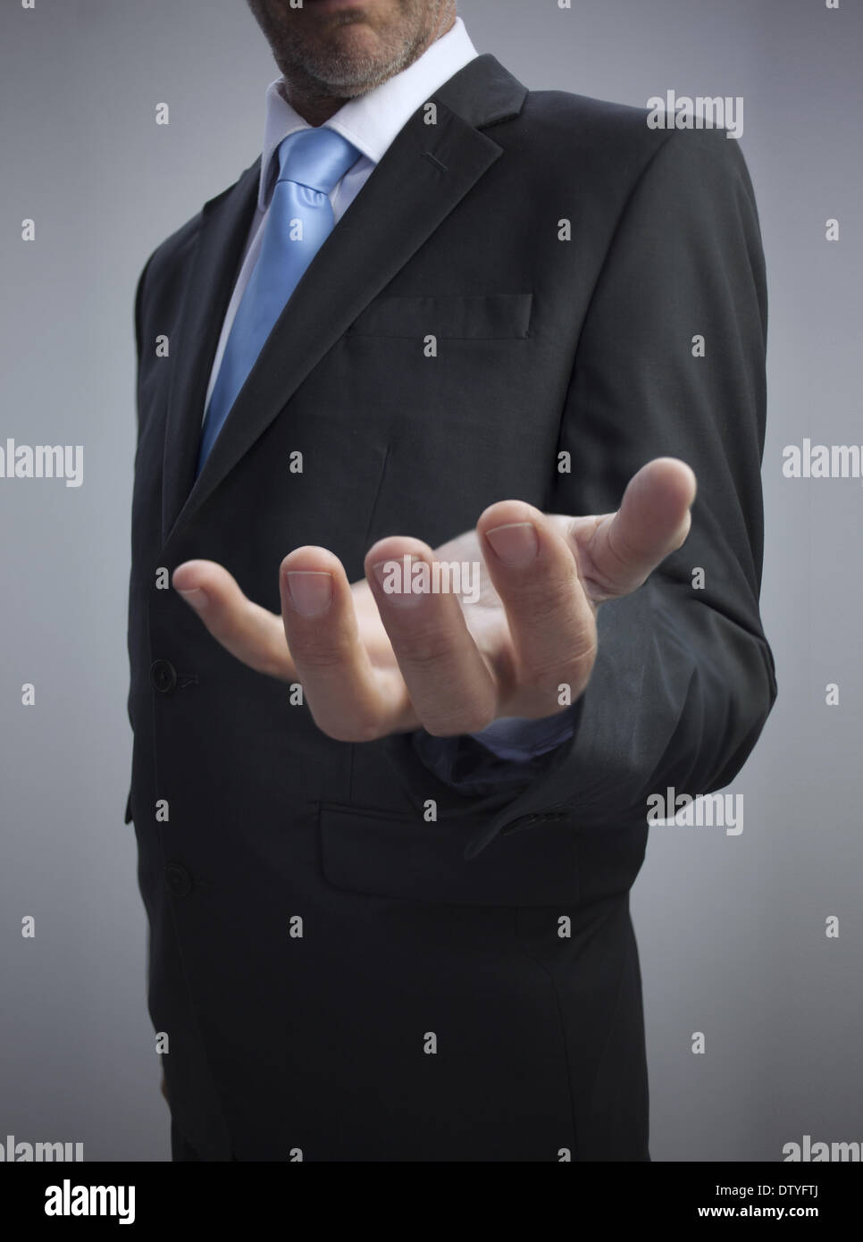 Businessman showing his empty hand Stock Photo - Alamy