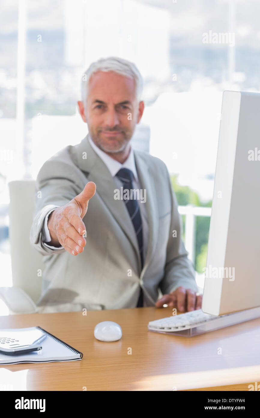 Hand reaching out of computer hi-res stock photography and images - Alamy