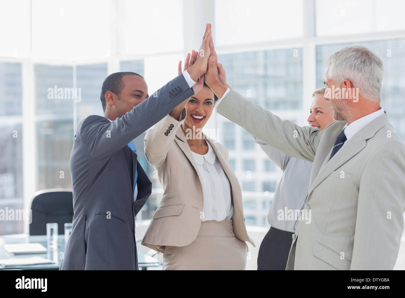 High fiving female coworkers hi-res stock photography and images - Alamy