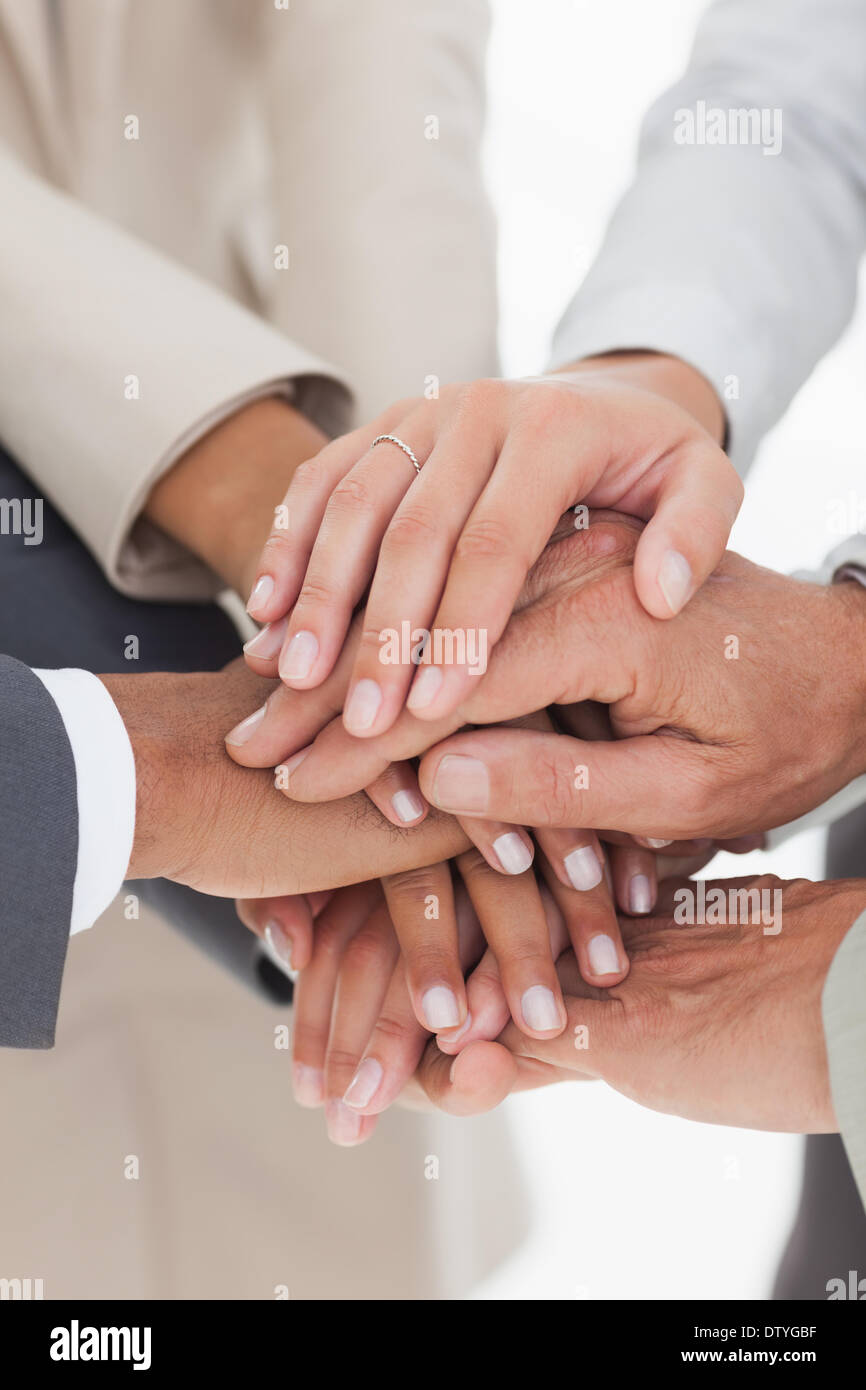 Business teams hands together Stock Photo - Alamy