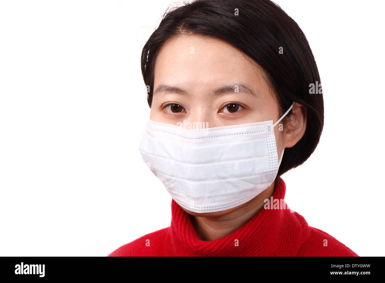 Asian woman wearing a face mask on white background Stock Photo - Alamy