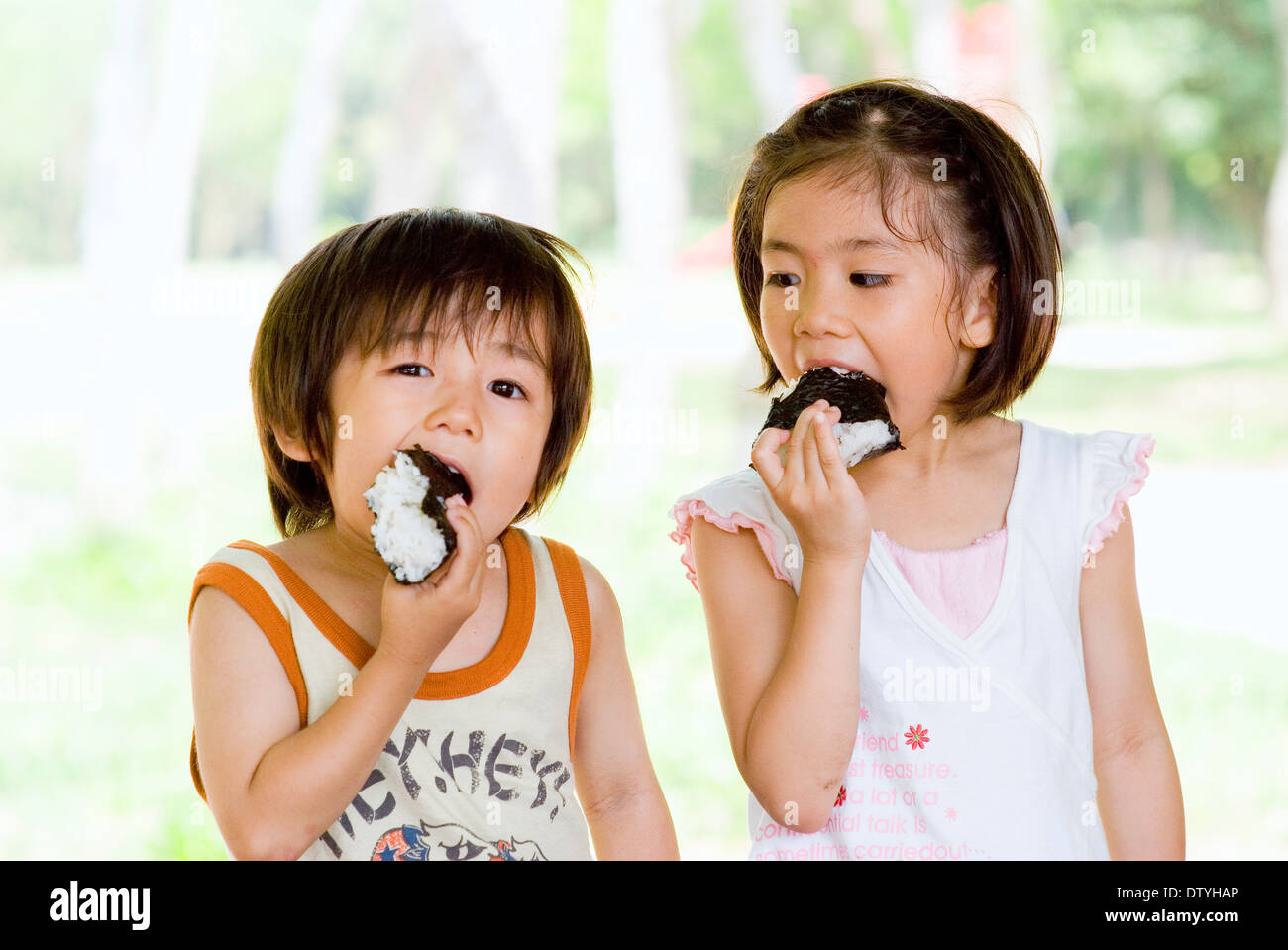 Boy eating rice ball hi-res stock photography and images - Alamy