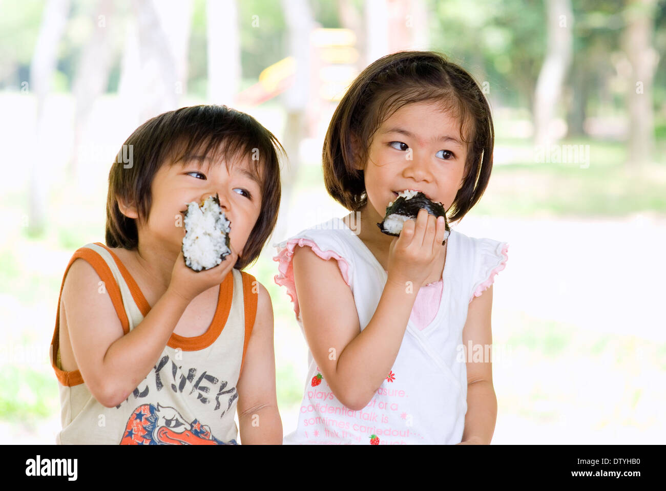 Boy eating rice ball hi-res stock photography and images - Alamy