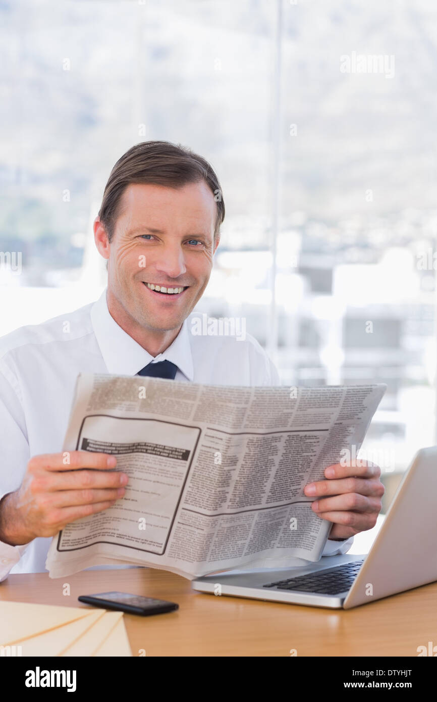 Man sitting at desk reading a newspaper hi-res stock photography and ...
