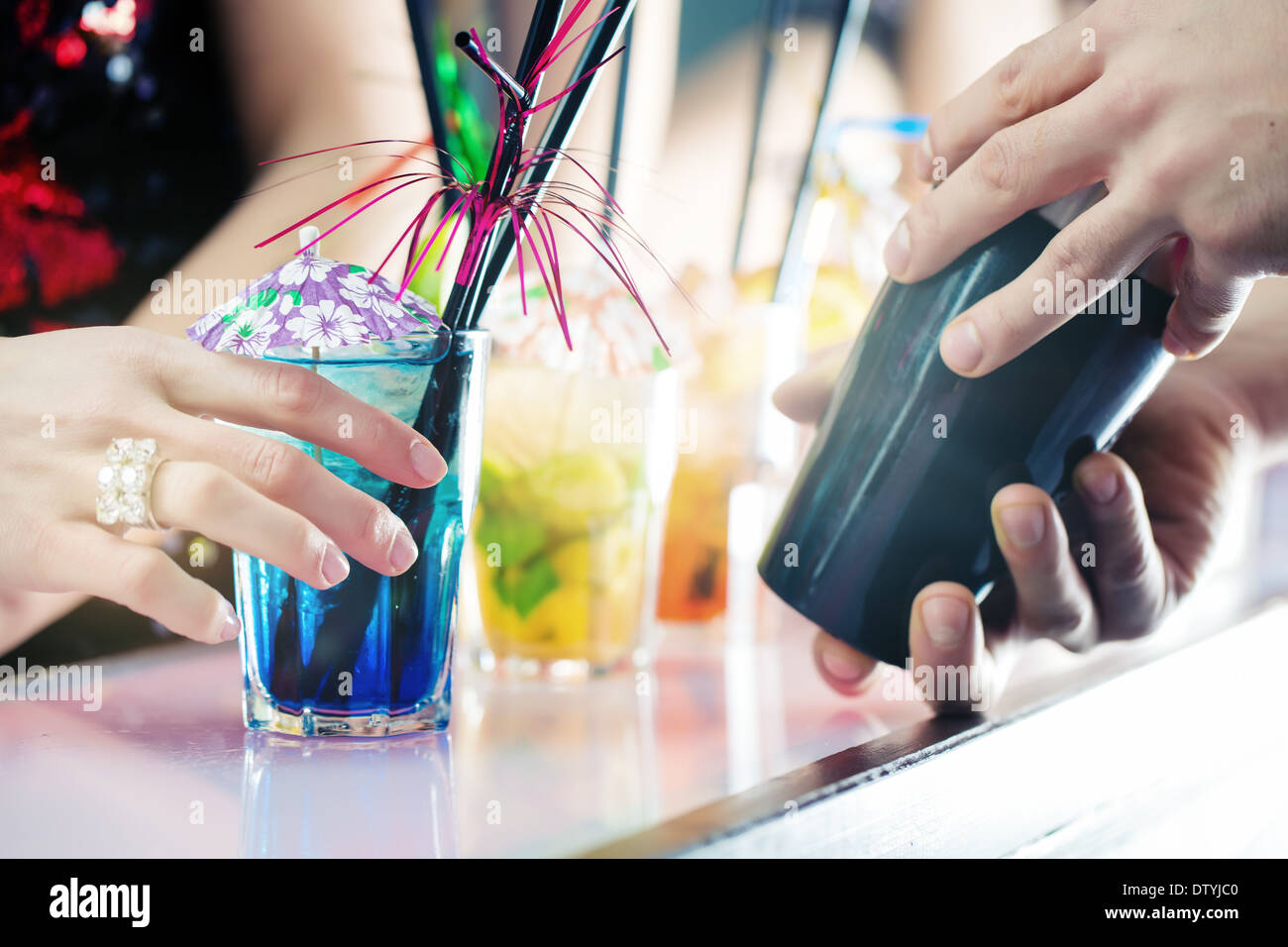 Party People in bar celebrating, group having fun with drinks and a ...