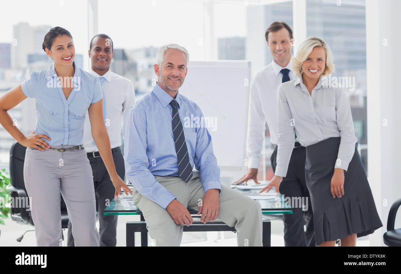 Team of cool business people posing together Stock Photo - Alamy